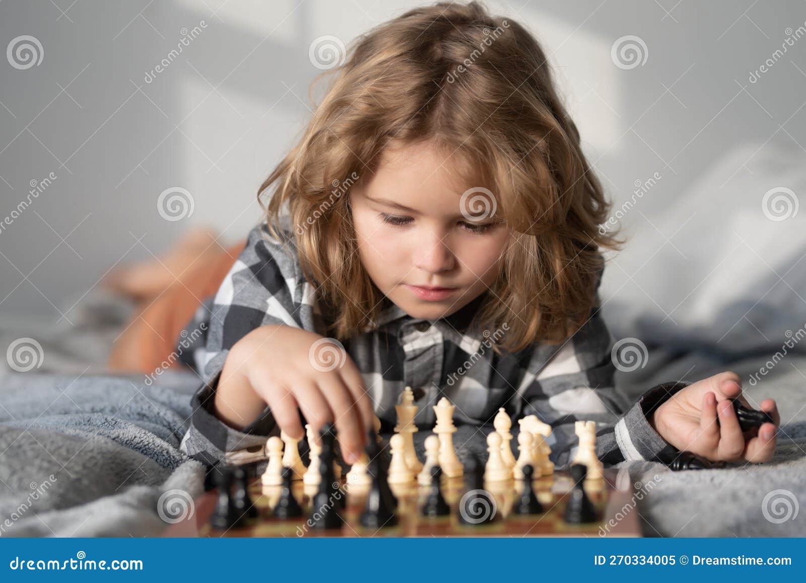 Clever Thinking Child. Clever Concentrated And Thinking Kid Playing ...