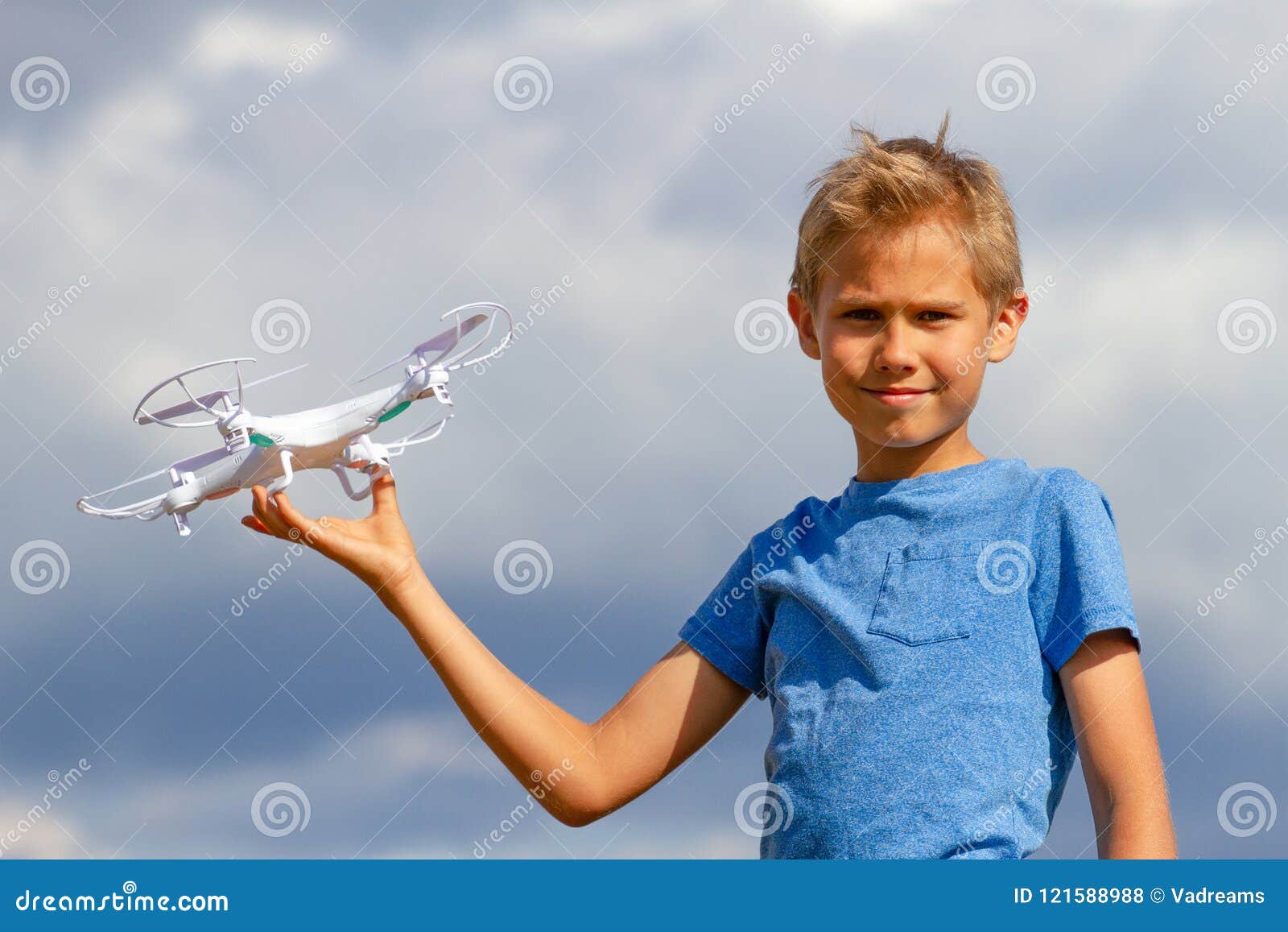 Kid Playing with Drone Outdoors Against Blue Sky Stock Photo - Image of ...