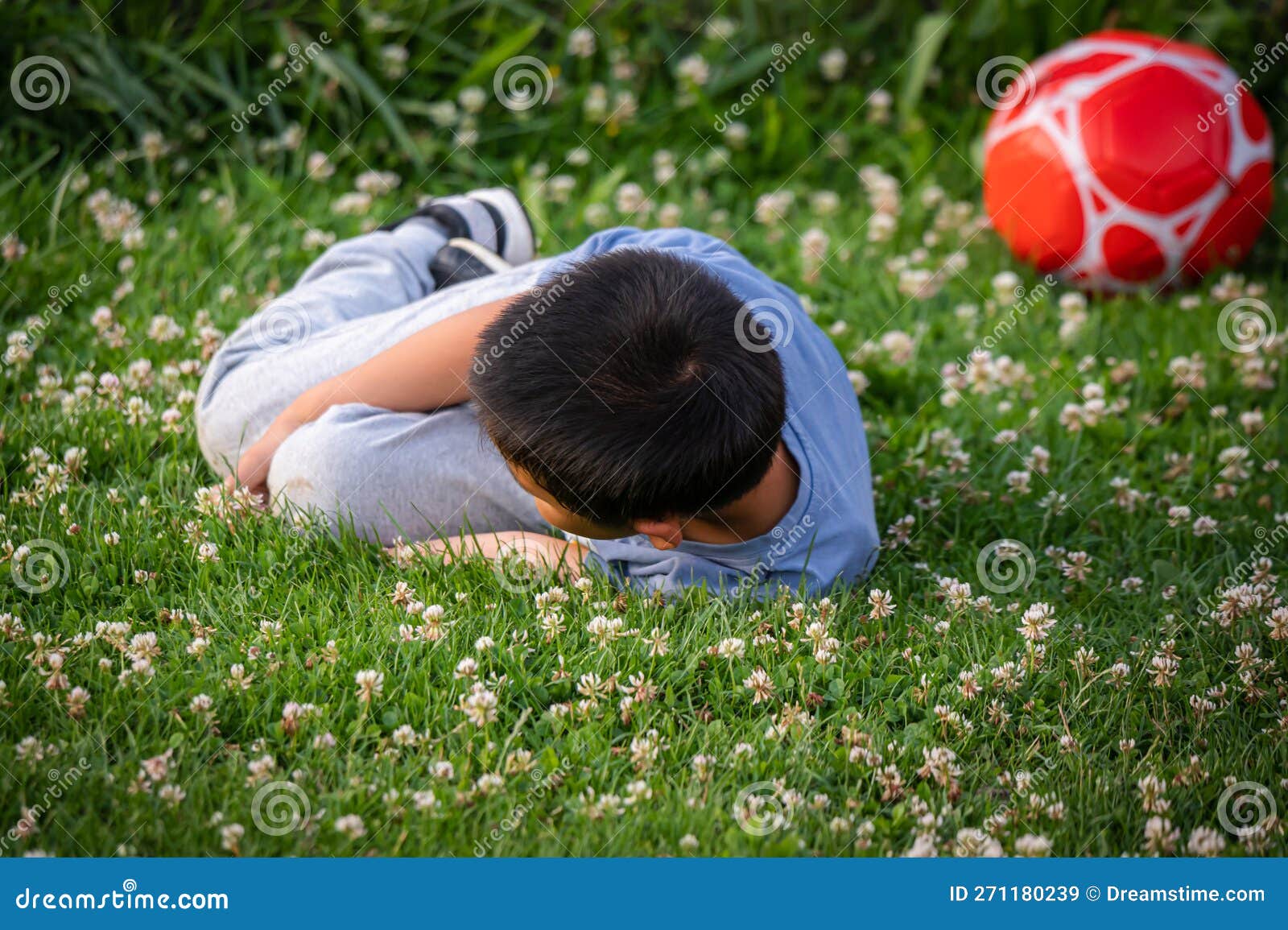 Child Playing Football. One Asian Boy Falling Down Stock Image - Image ...