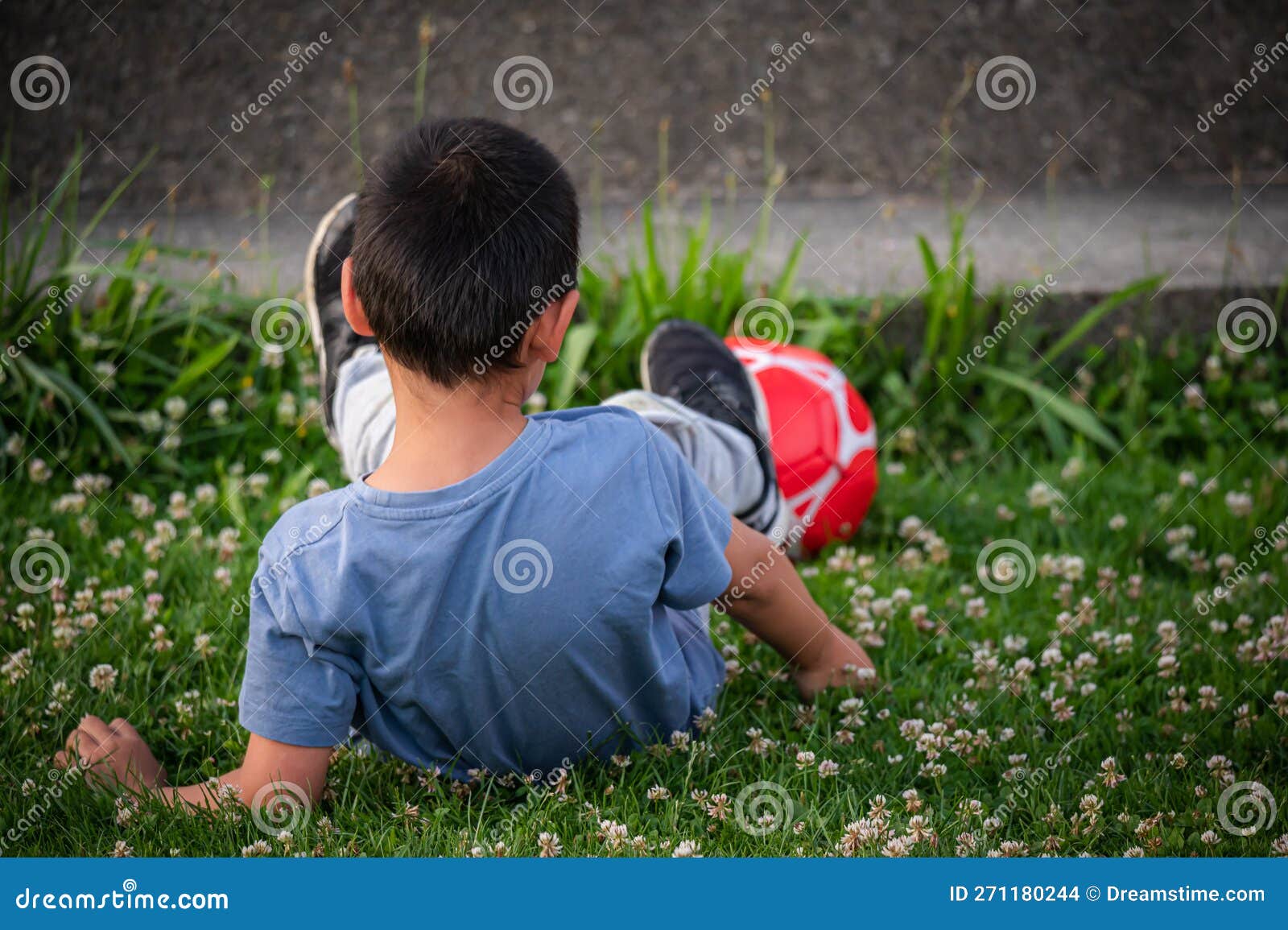 Child Playing Football. One Asian Boy Falling Down Stock Photo - Image ...