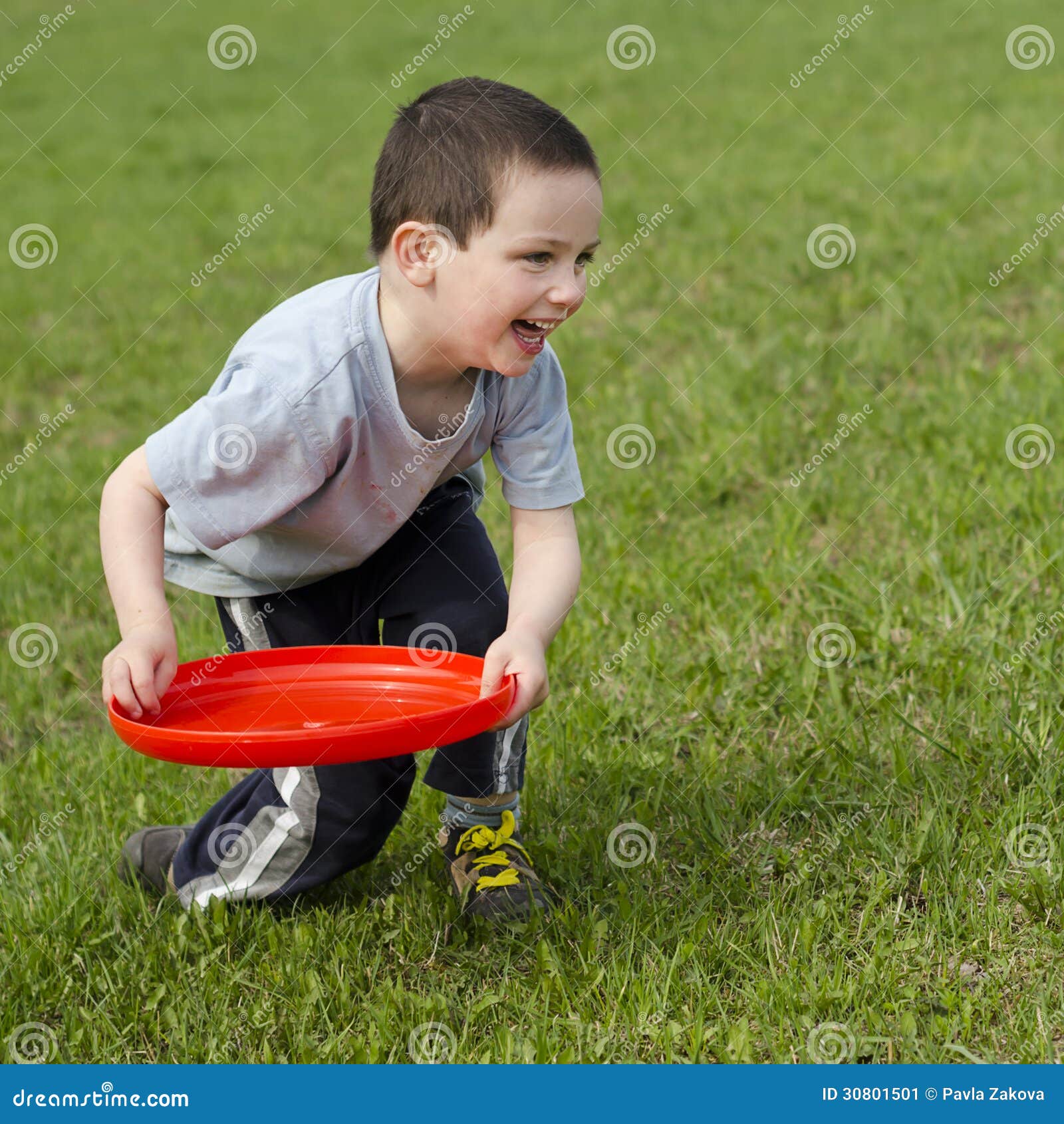 Child playing with frisbee stock image. Image of energy - 30801501