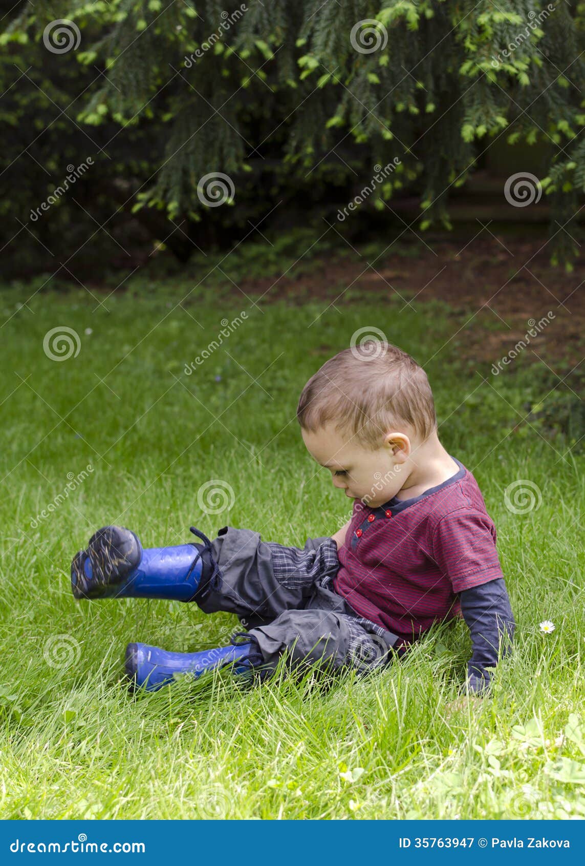 Child playing in grass stock image. Image of little, explore - 35763947