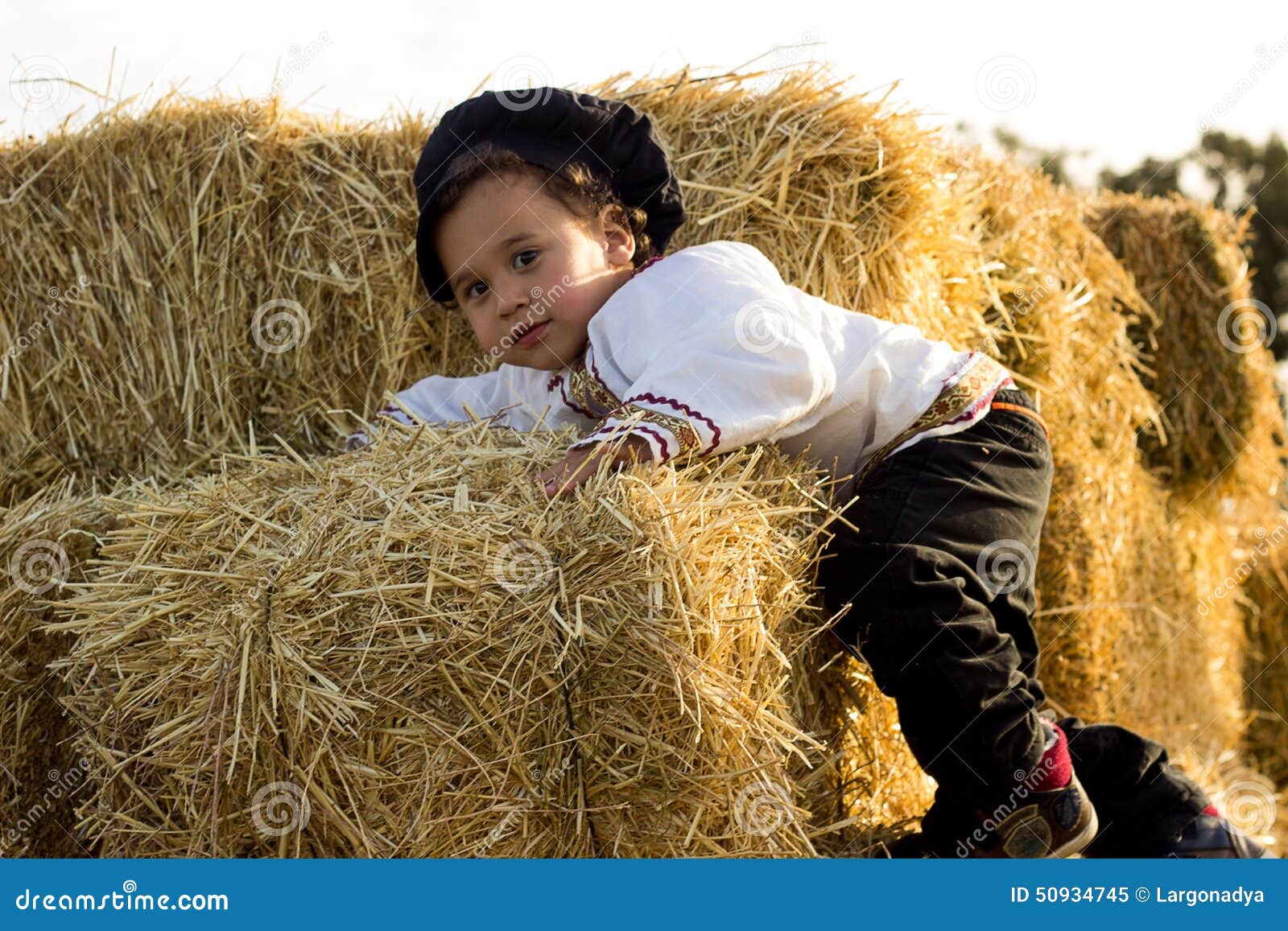 Child Playing in a Haystack. Stock Image - Image of countryside ...