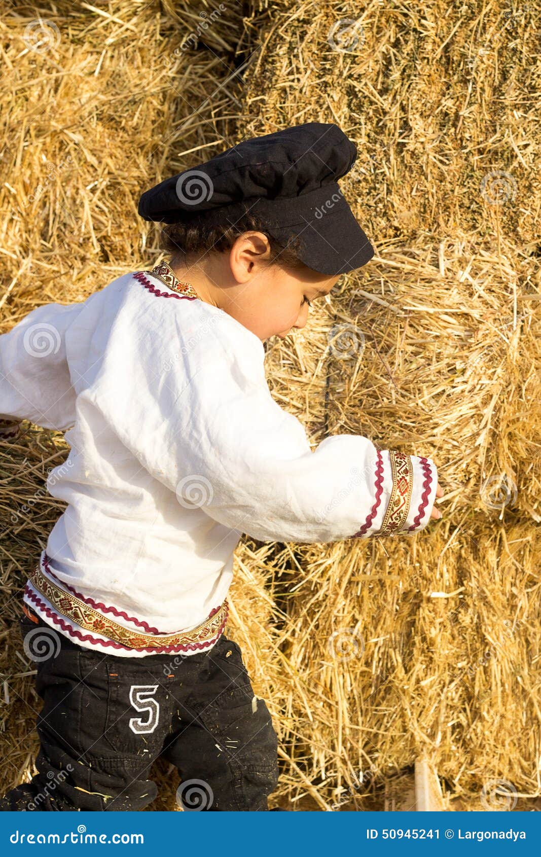Child Playing in a Haystack. Stock Image - Image of field, landscape ...