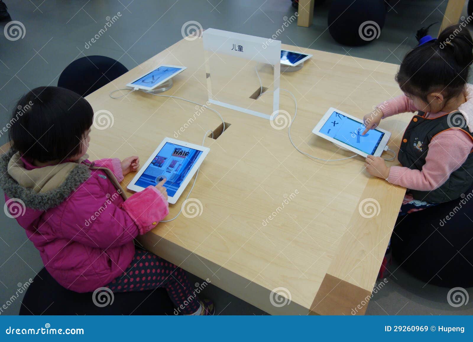 Child playing ipad editorial stock image. Image of book - 29260969