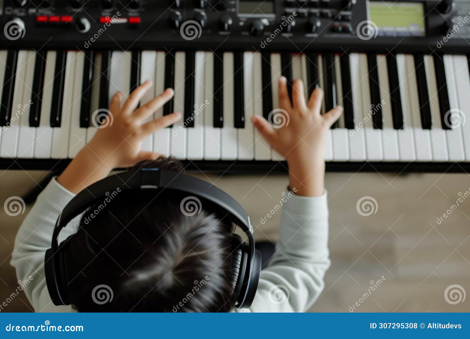 Child Playing a Keyboard with Headphones on Stock Photo - Image of ...