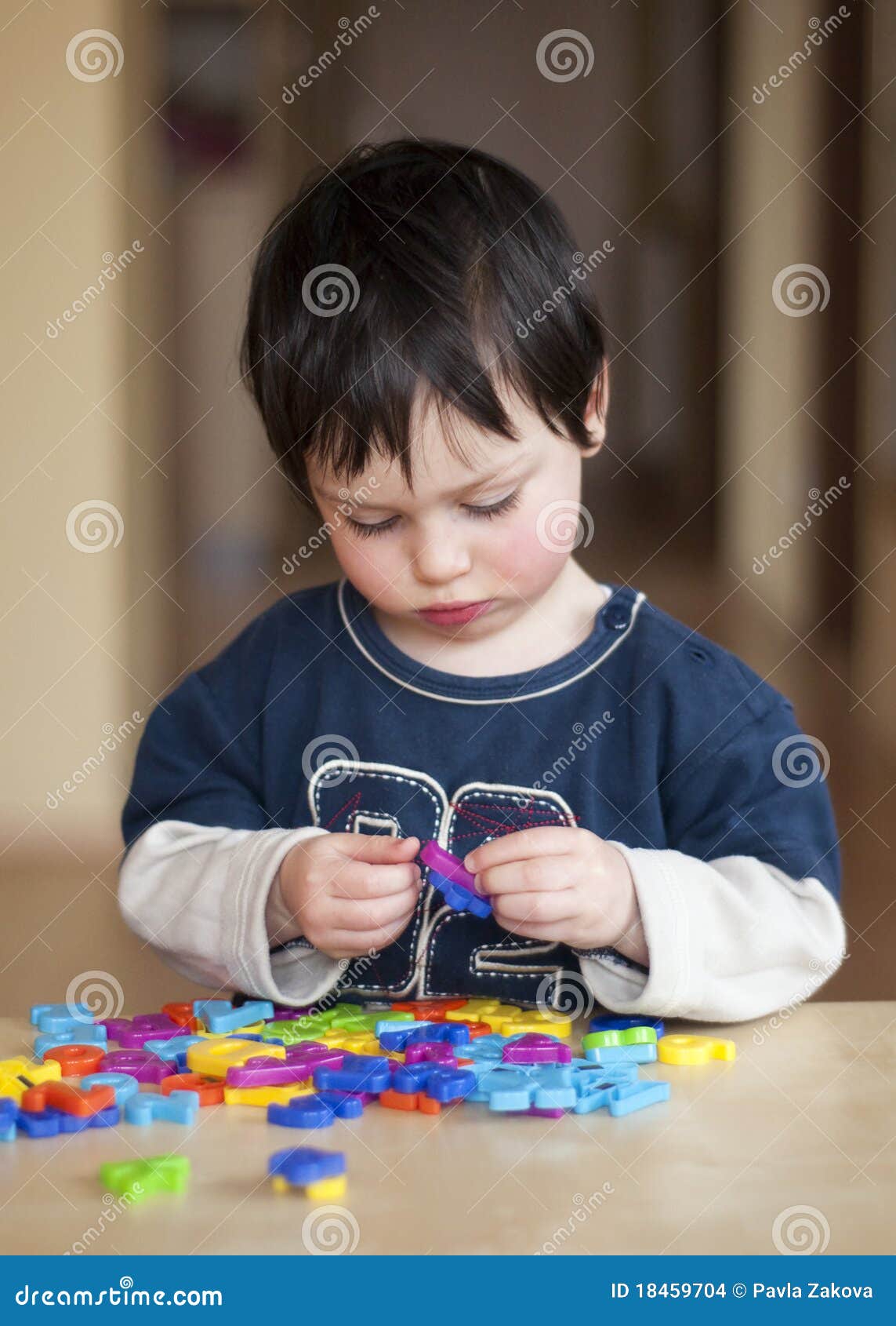Child playing with letters stock photo. Image of learning - 18459704