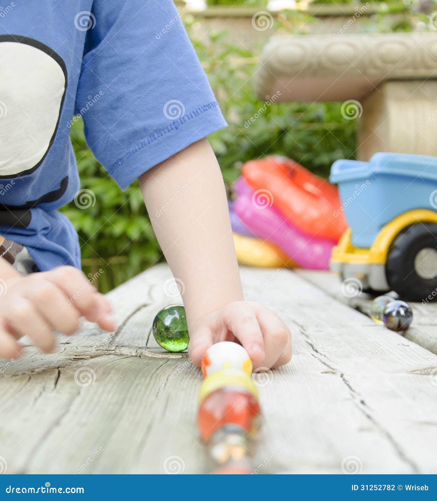Child playing marbles stock photo. Image of hands, youth - 31252782