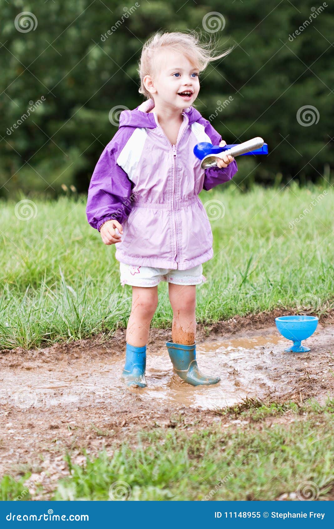 Child Playing in Mud Puddle Stock Image - Image of blue, outdoors: 11148955