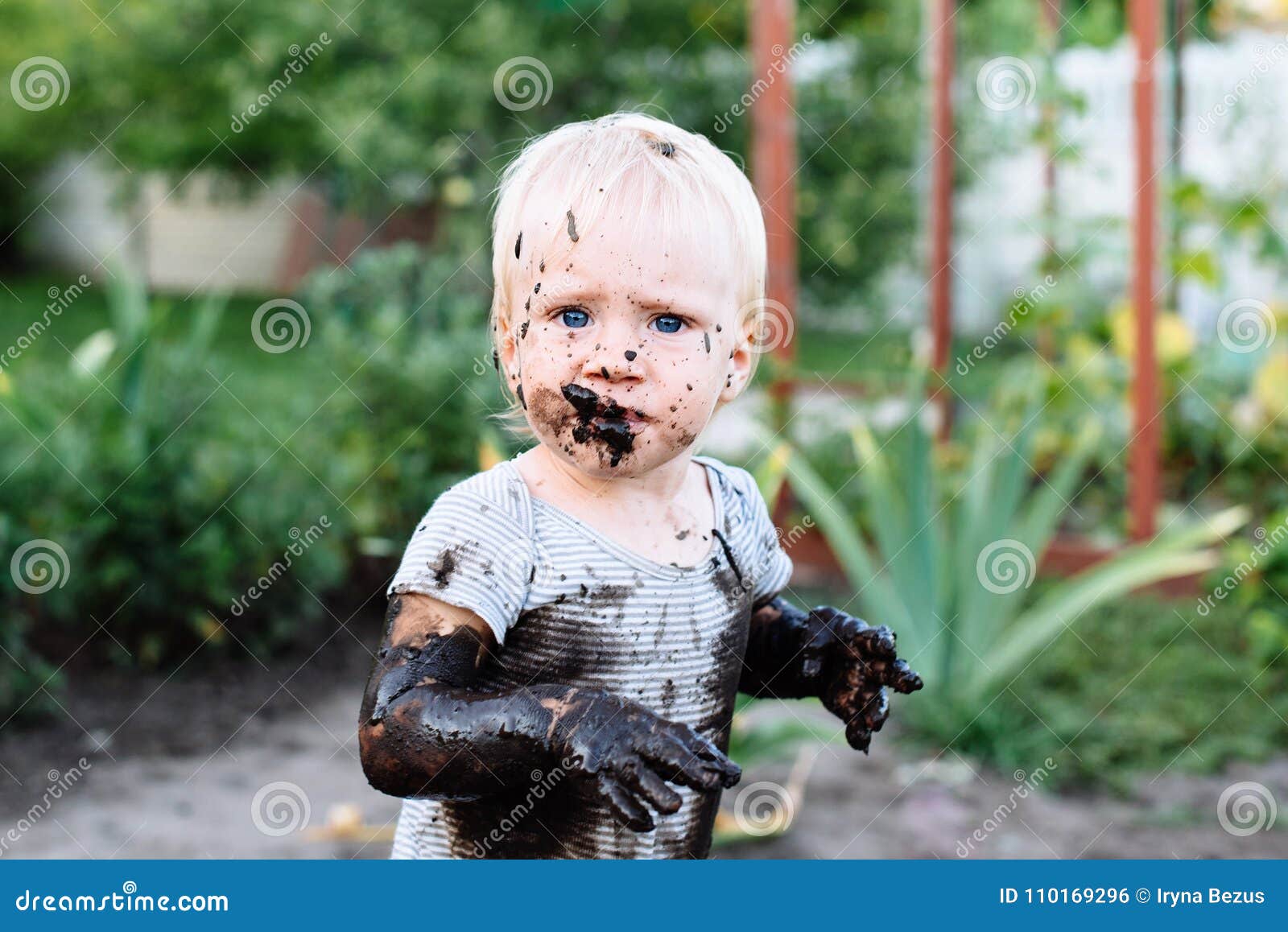 Child Playing in the Mud on the Street Stock Photo - Image of summer ...