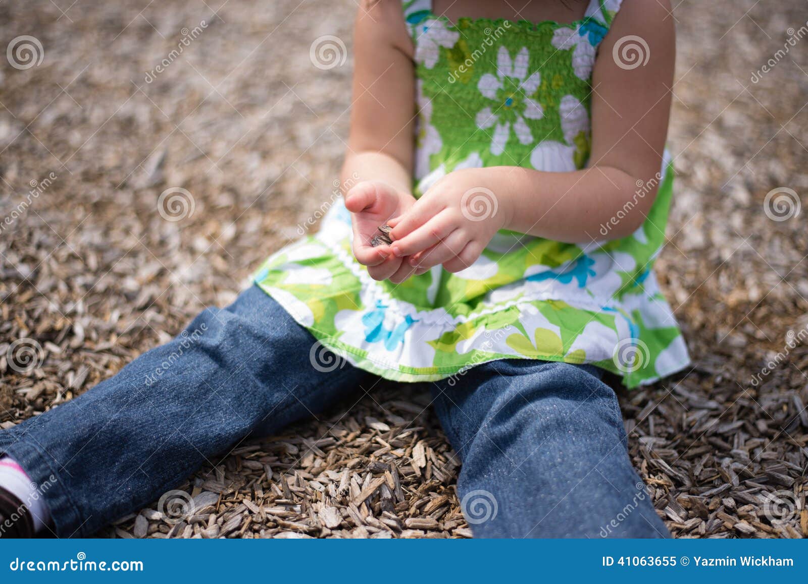 Child playing with mulch stock image. Image of playing - 41063655