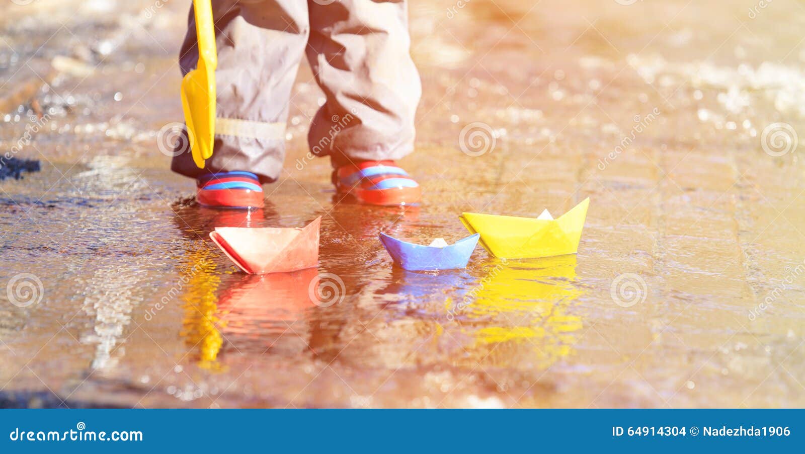 Child Playing with Paper Boats in Spring Water Stock Photo - Image of ...