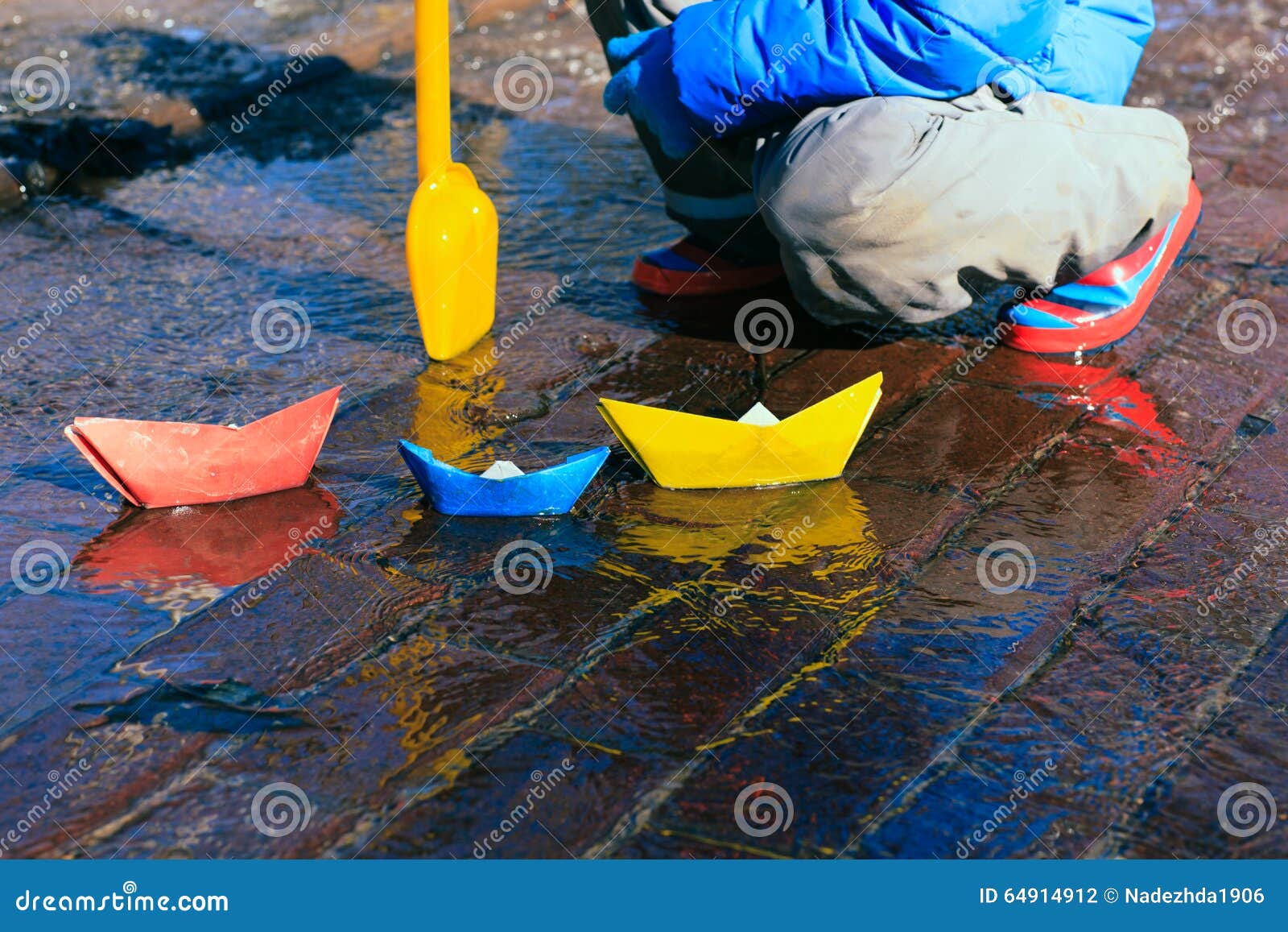 Child Playing with Paper Boats in Spring Water Stock Photo - Image of ...