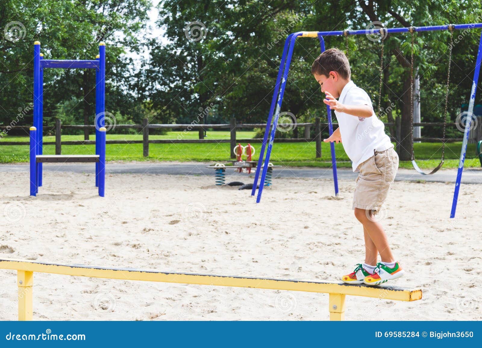 Child Playing on the Park Play Structure Balance Beam Stock Photo ...