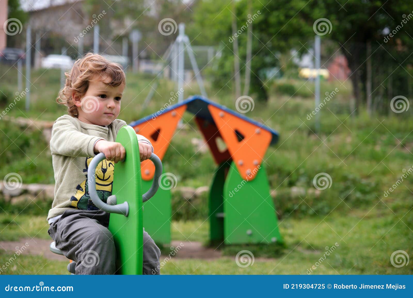 Child Playing in the Park with a Spring Rocker Stock Image - Image of ...