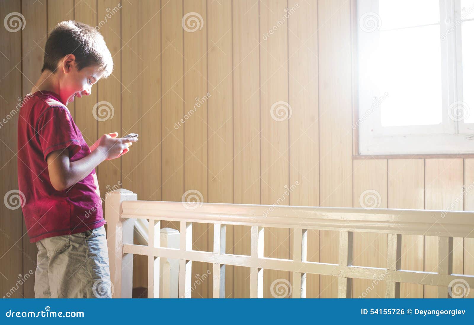 Child playing with phone stock photo. Image of white - 54155726