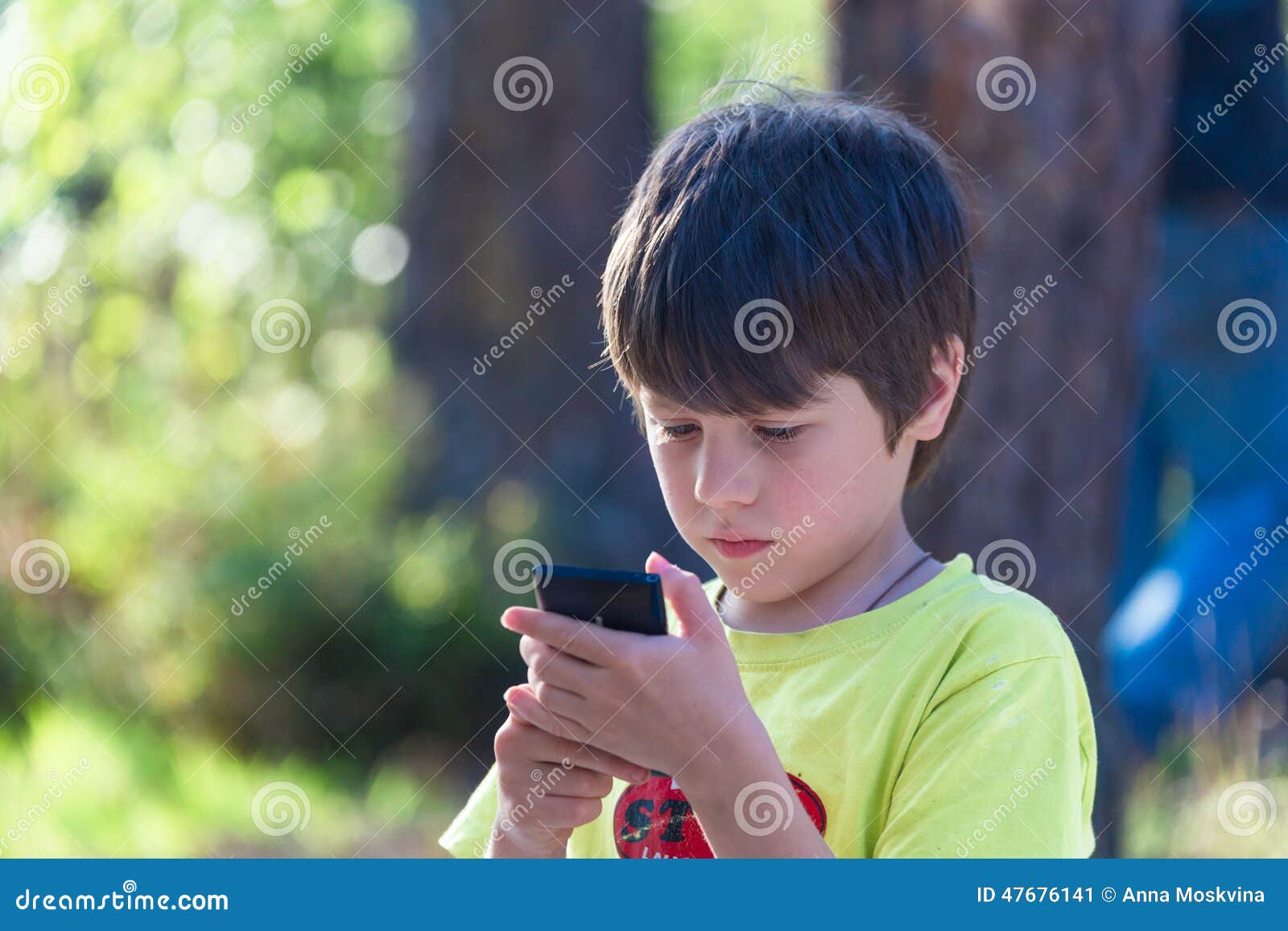 Child Playing Phone Outdoors Stock Image - Image of happy, male: 47676141