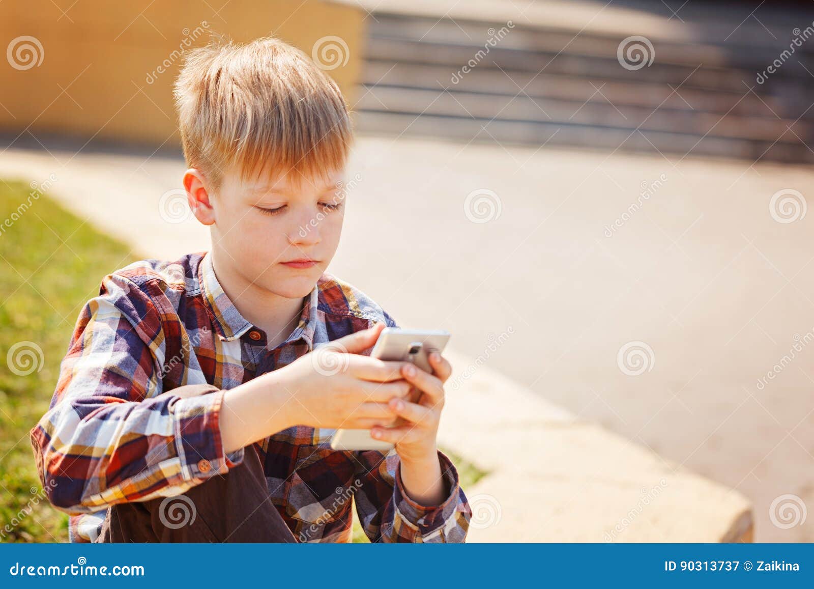Child Playing Phone Outdoors in Sunny Day. Stock Image - Image of ...