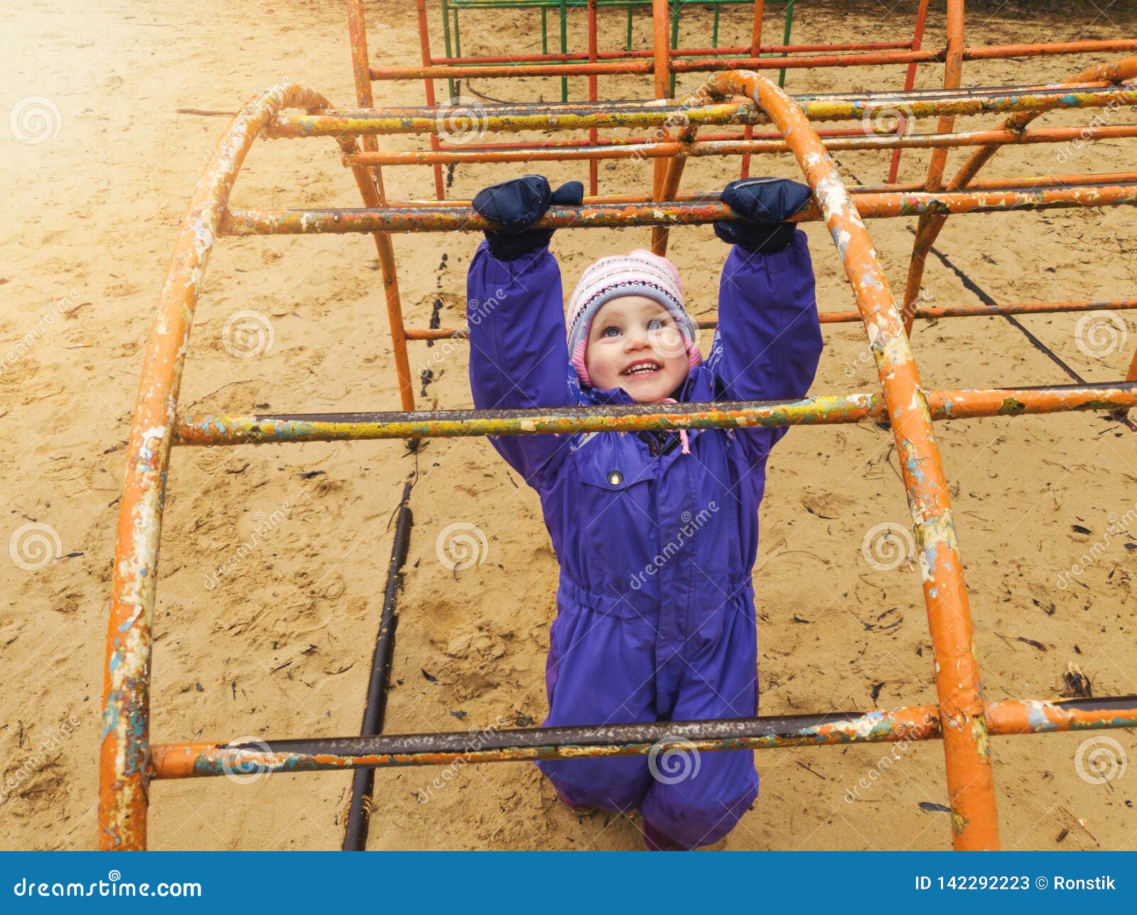 Child Playing at Playground on Cool Spring Day Stock Image - Image of ...