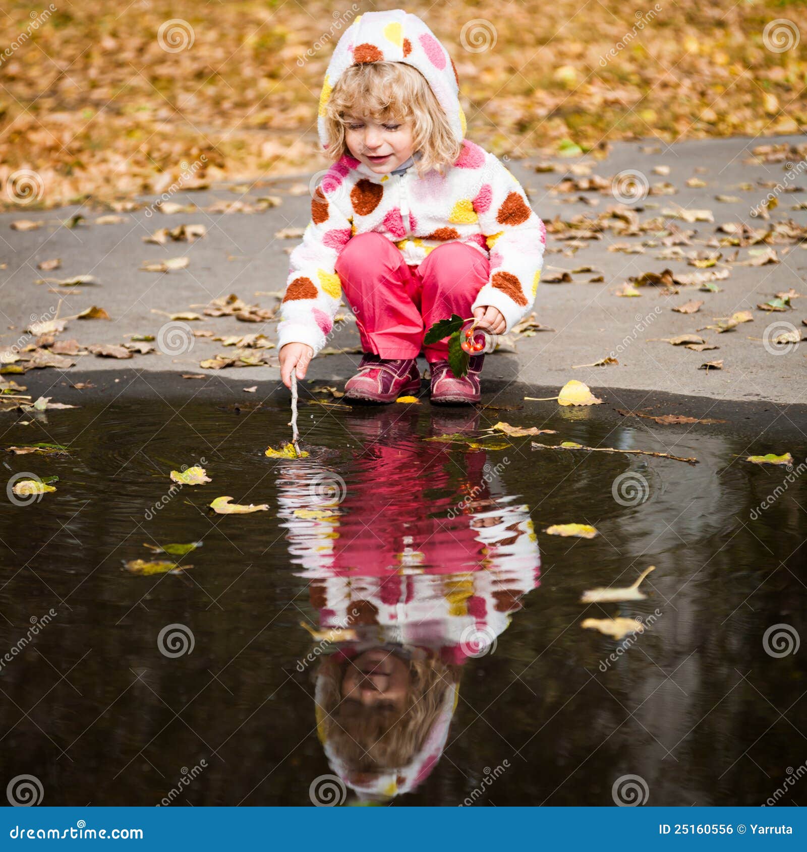 Child playing in puddle stock photo. Image of outdoors - 25160556