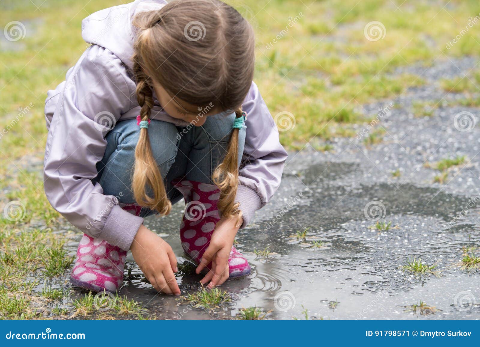 The Child Playing in a Puddle Stock Image - Image of caucasian, playing ...