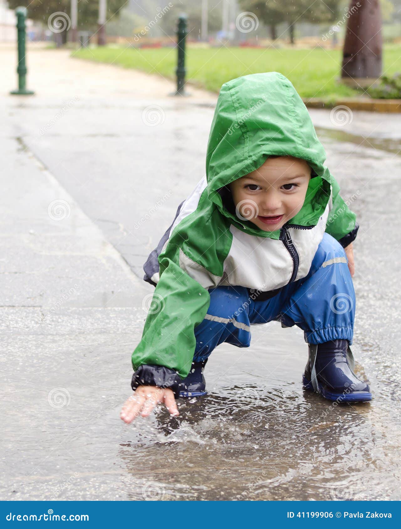 Child playing in puddle stock photo. Image of child, splash - 41199906