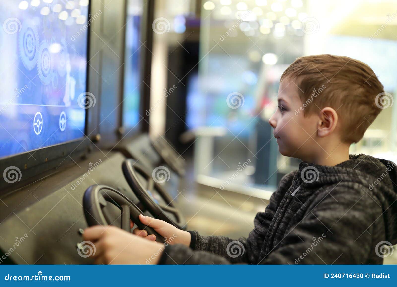 Child Playing Racing Simulator Game Stock Photo - Image of arcade ...