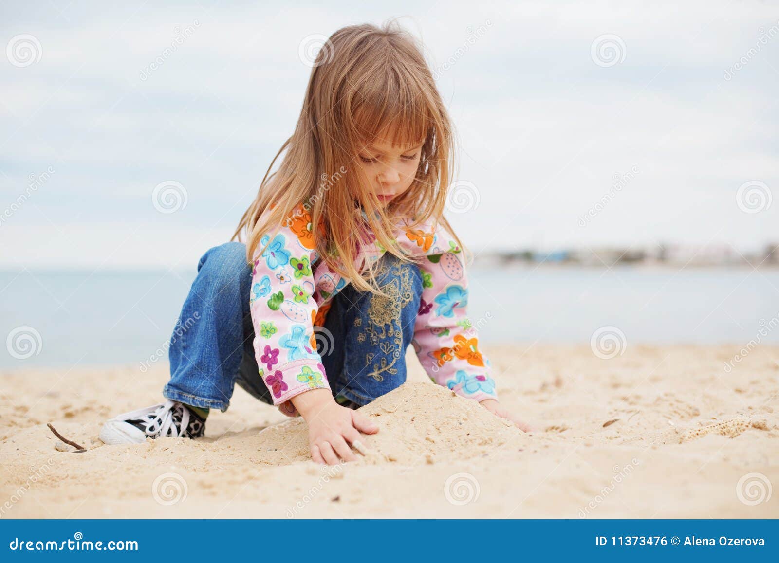 Child playing with sand stock photo. Image of innocent - 11373476