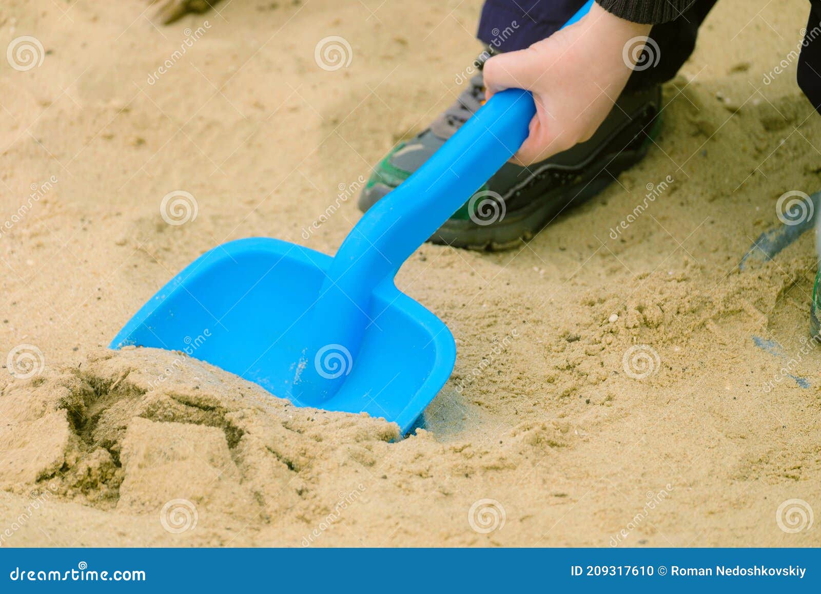 Child Playing with Sand and Plastic Shovel Stock Photo - Image of hand ...
