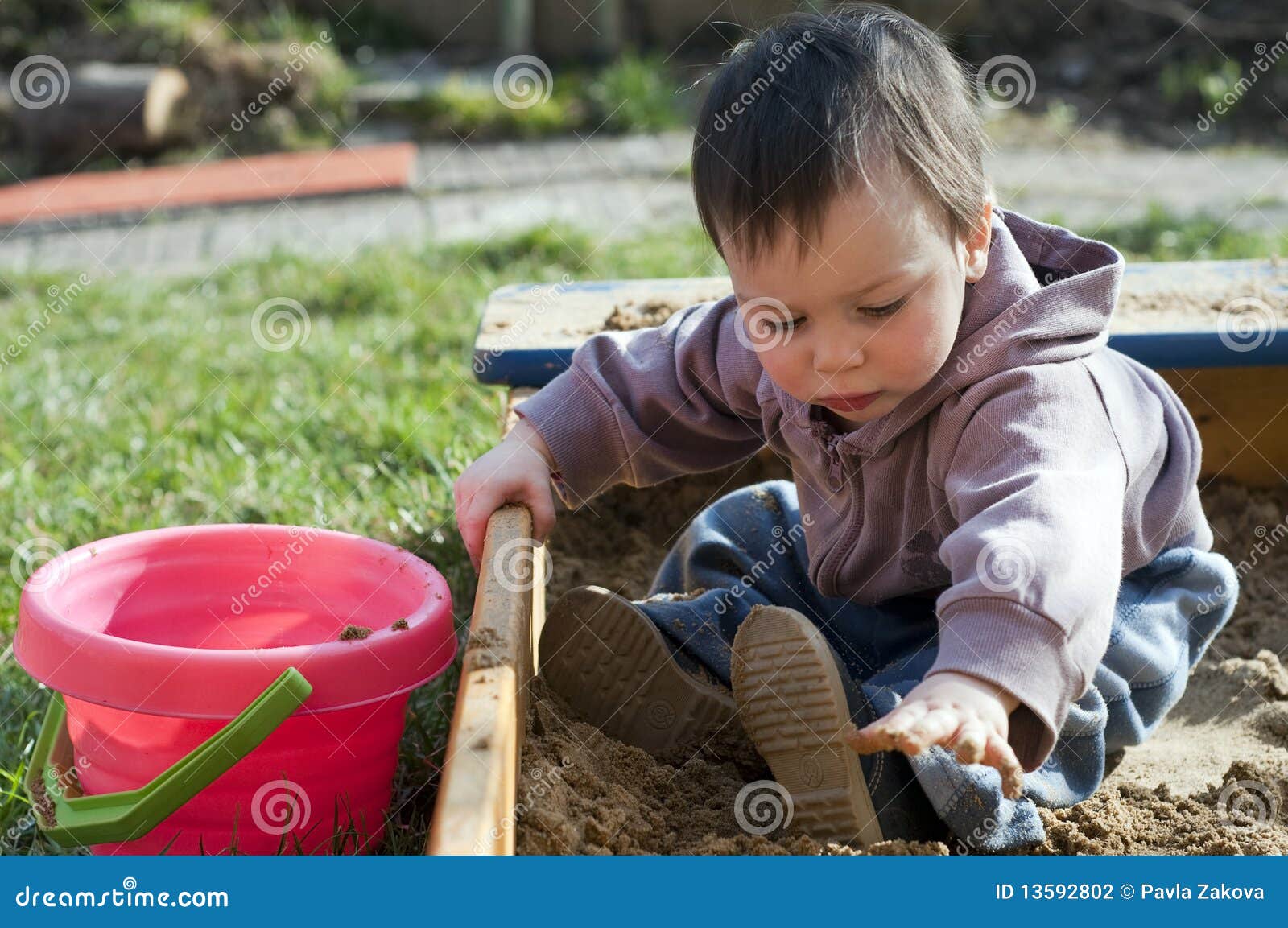 Child playing in sandbox stock photo. Image of game, sandy - 13592802