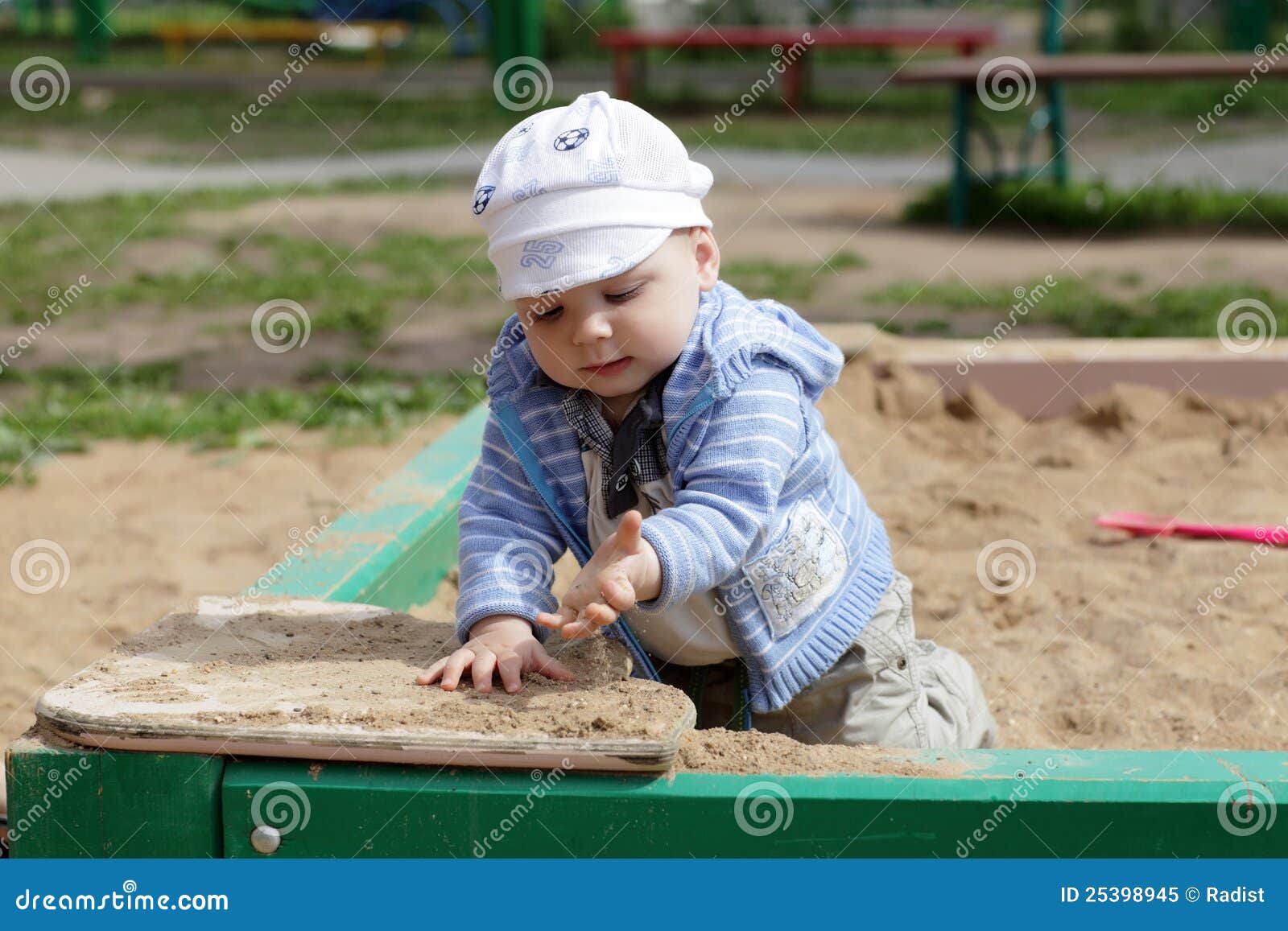 Child playing in sandbox stock image. Image of human - 25398945