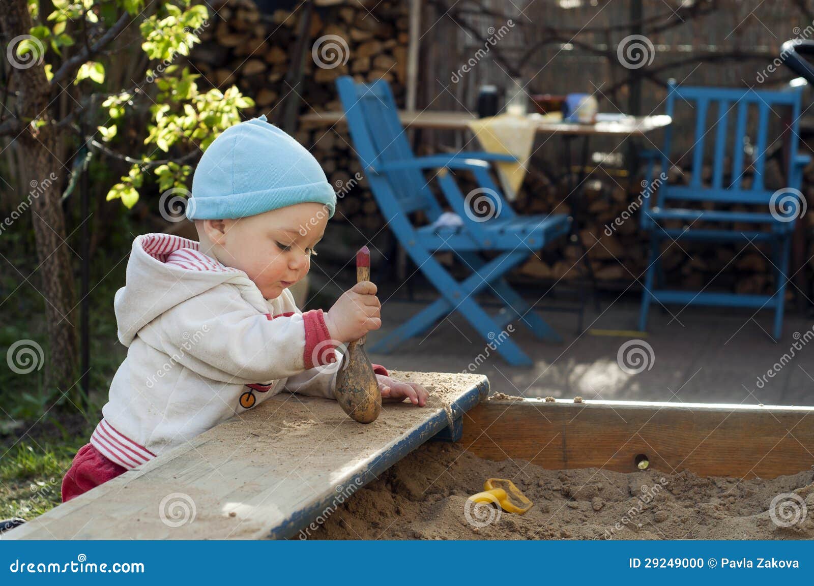 Child playing in sandbox stock photo. Image of girl, outside - 29249000