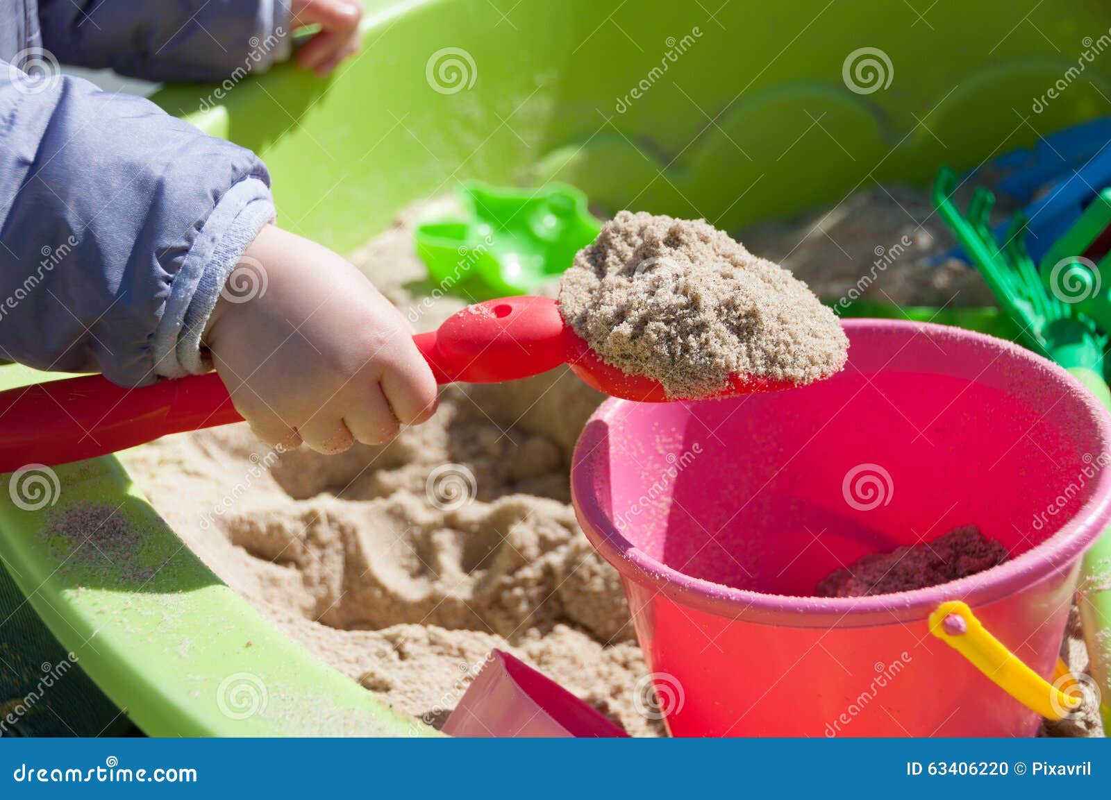 Child playing in sandbox stock photo. Image of concept - 63406220