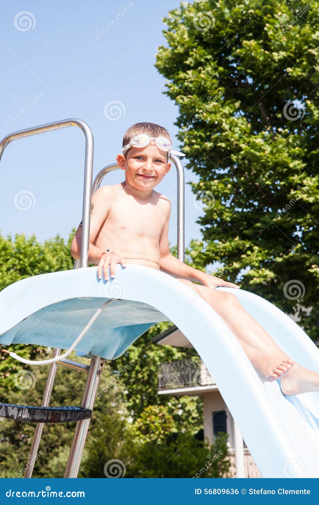 Child Playing with the Slide in the Pool Stock Photo - Image of slide ...