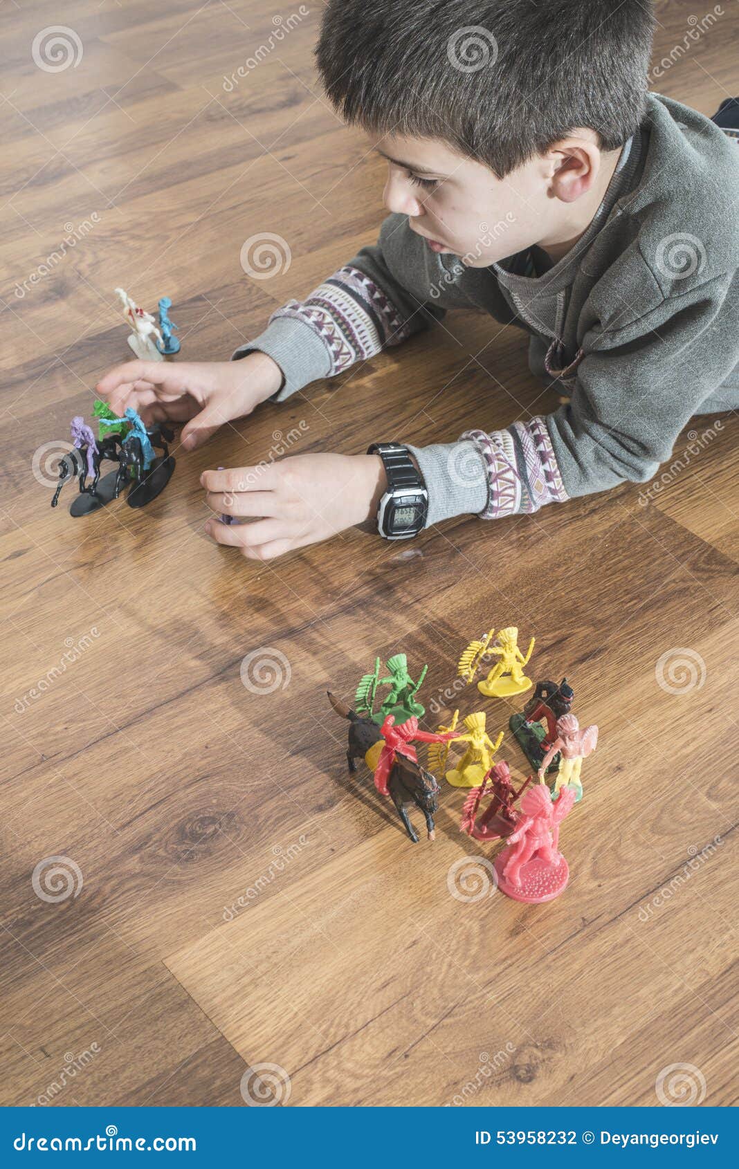 Child Playing with Small Toys Stock Photo - Image of toys, people: 53958232