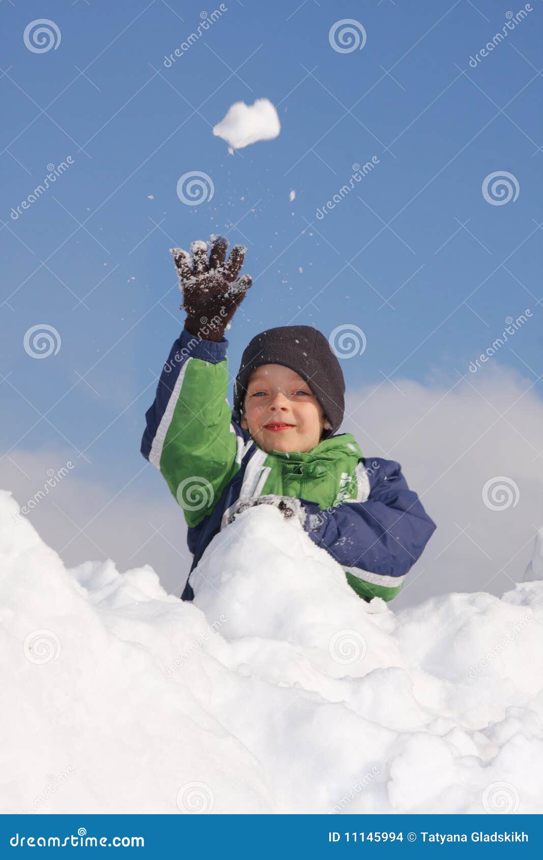 Child playing snowballs stock photo. Image of playing - 11145994