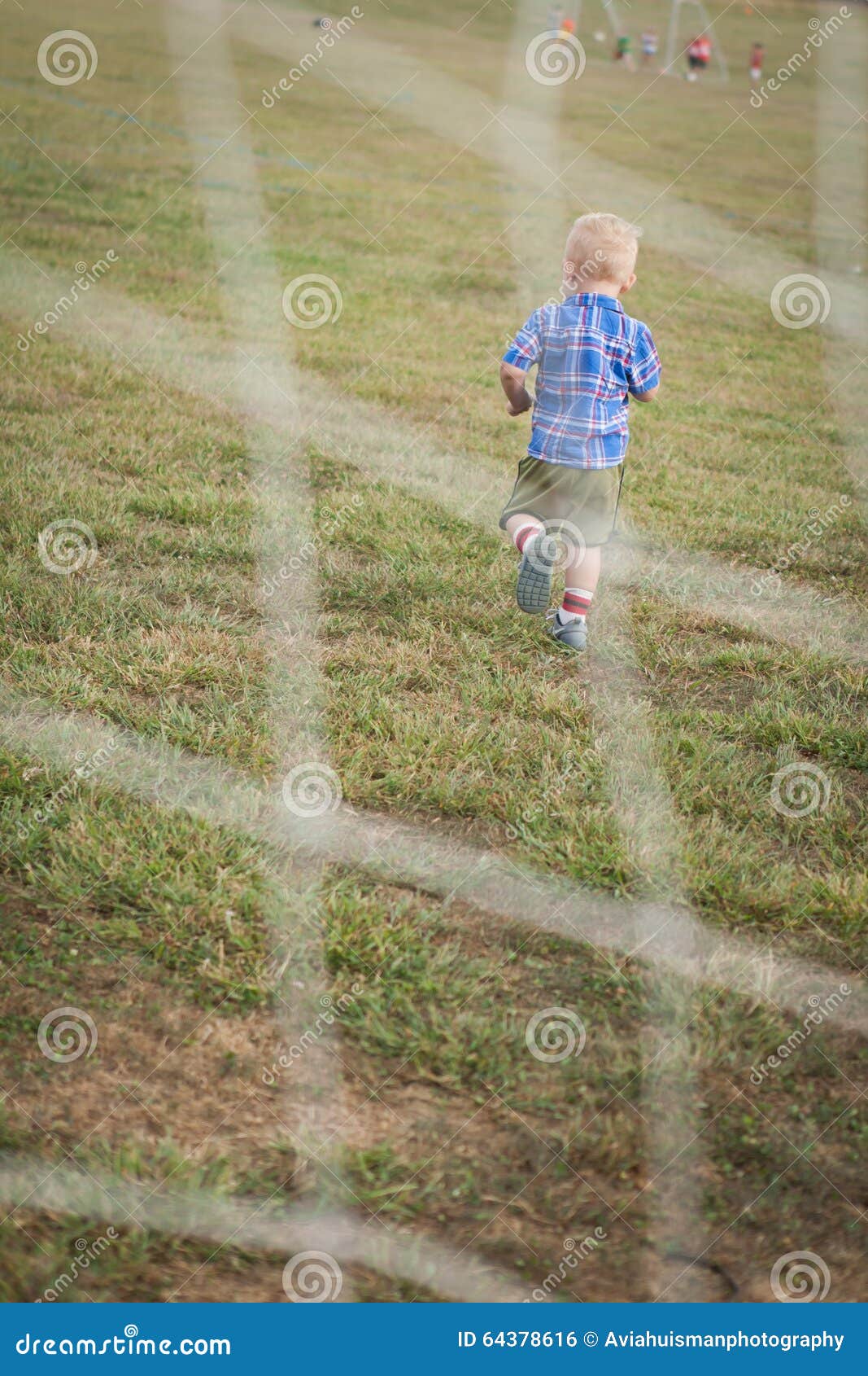 Child Playing Soccer stock photo. Image of network, green - 64378616