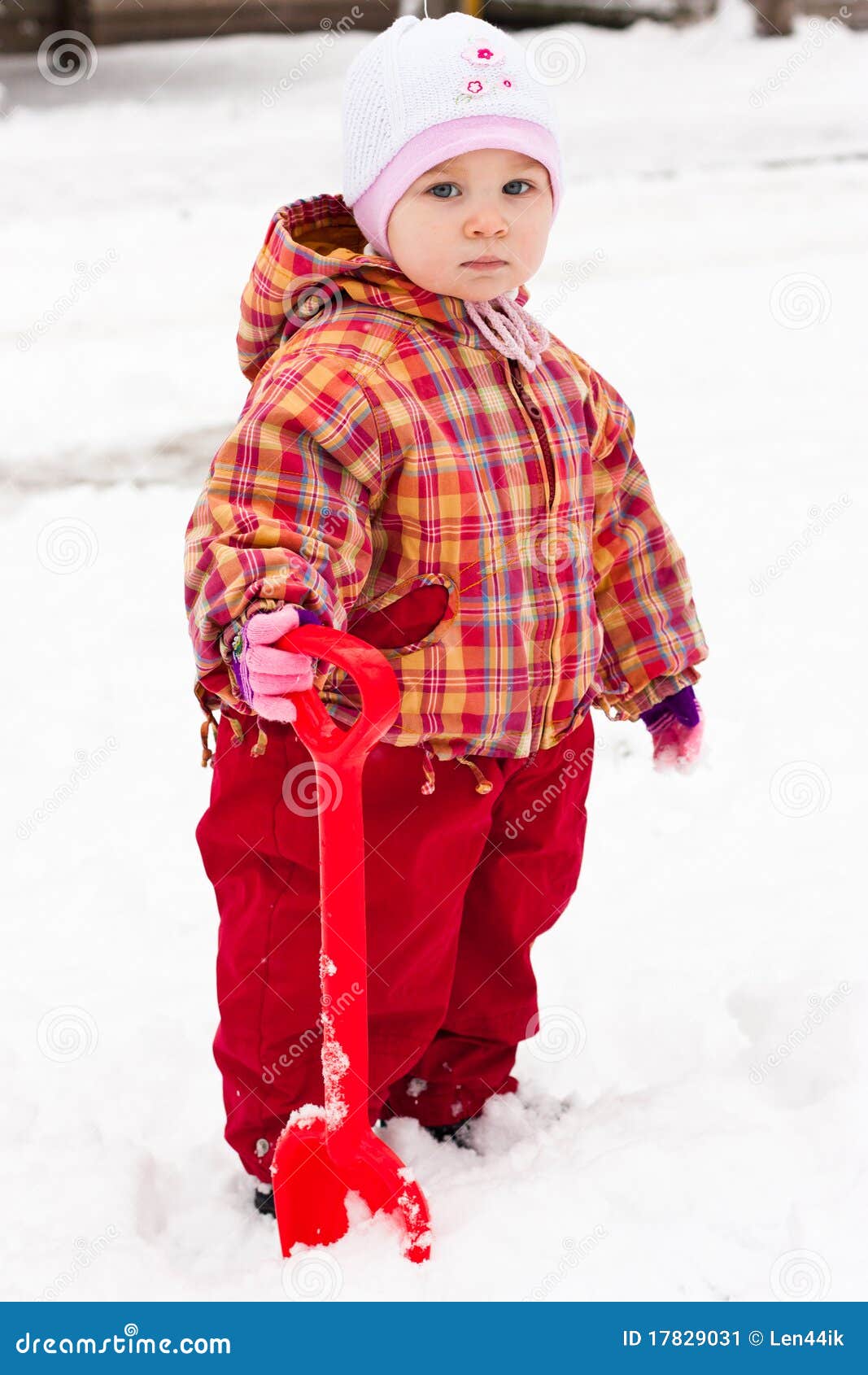 Child Playing with Spade in Snow Stock Image - Image of glove, clothing ...