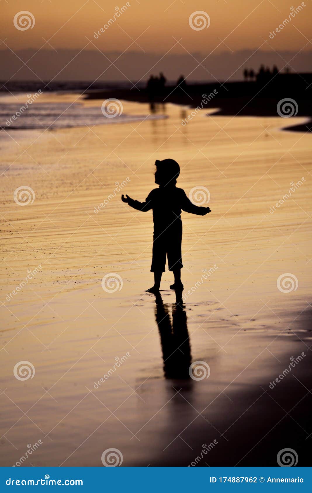 A child playing at sunset stock photo. Image of playing - 174887962