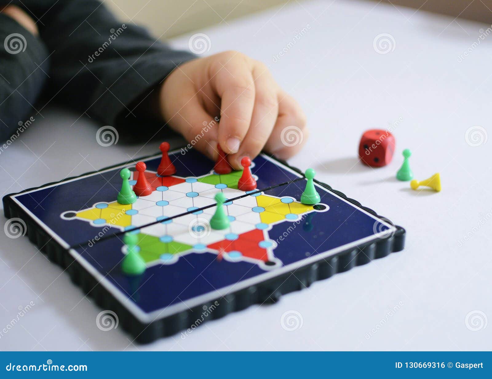 Child playing table game stock photo. Image of time - 130669316