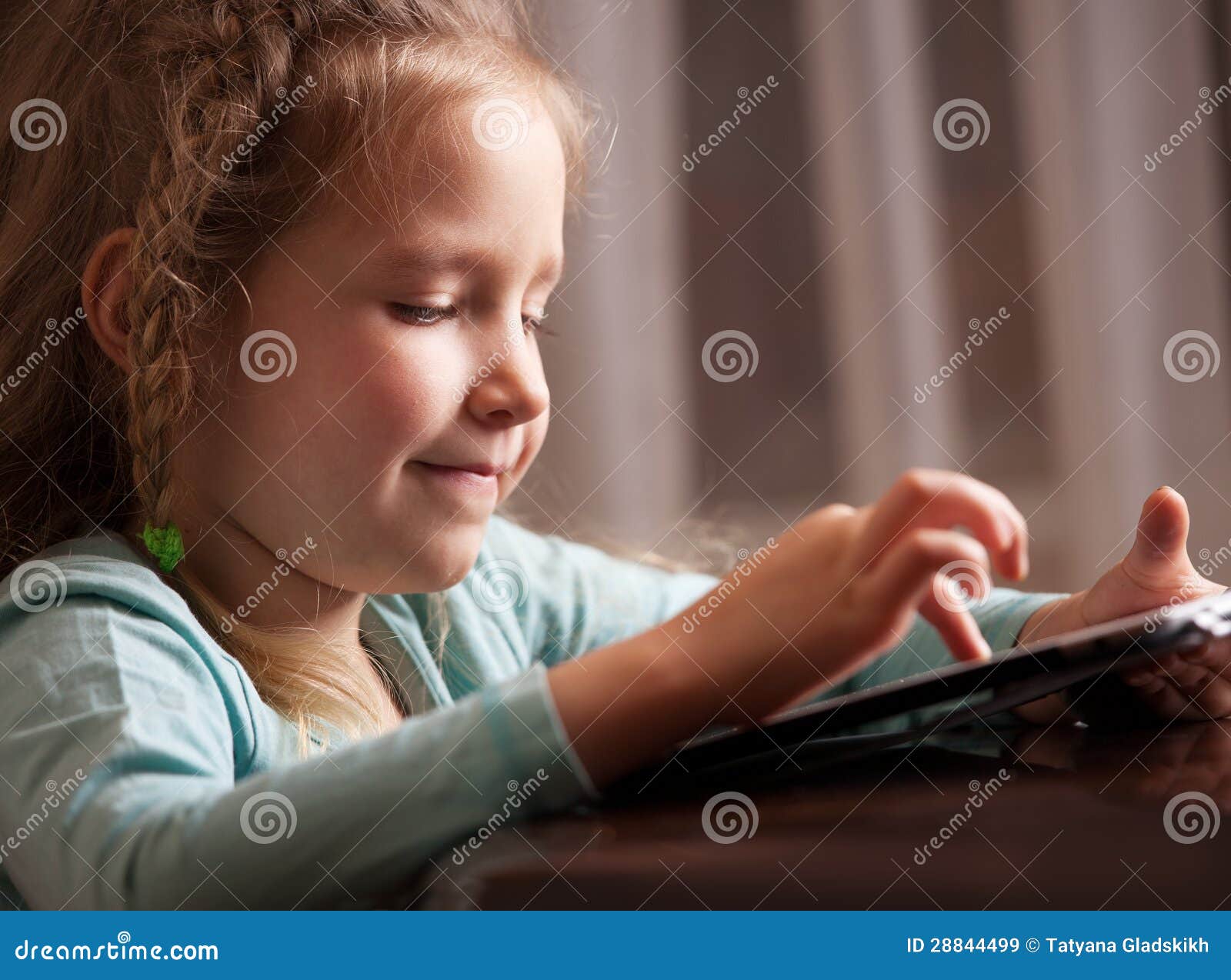 Child playing on tablet stock image. Image of female - 28844499