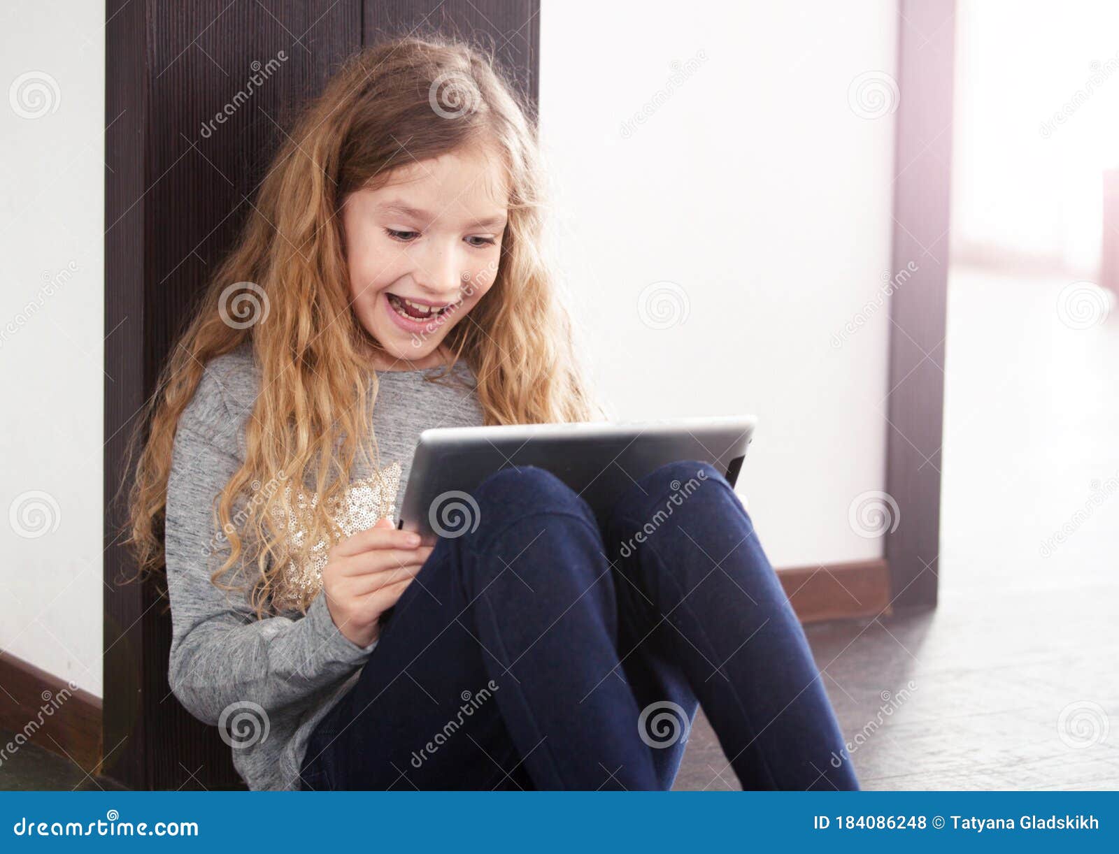 Child playing at tablet stock photo. Image of screen - 184086248