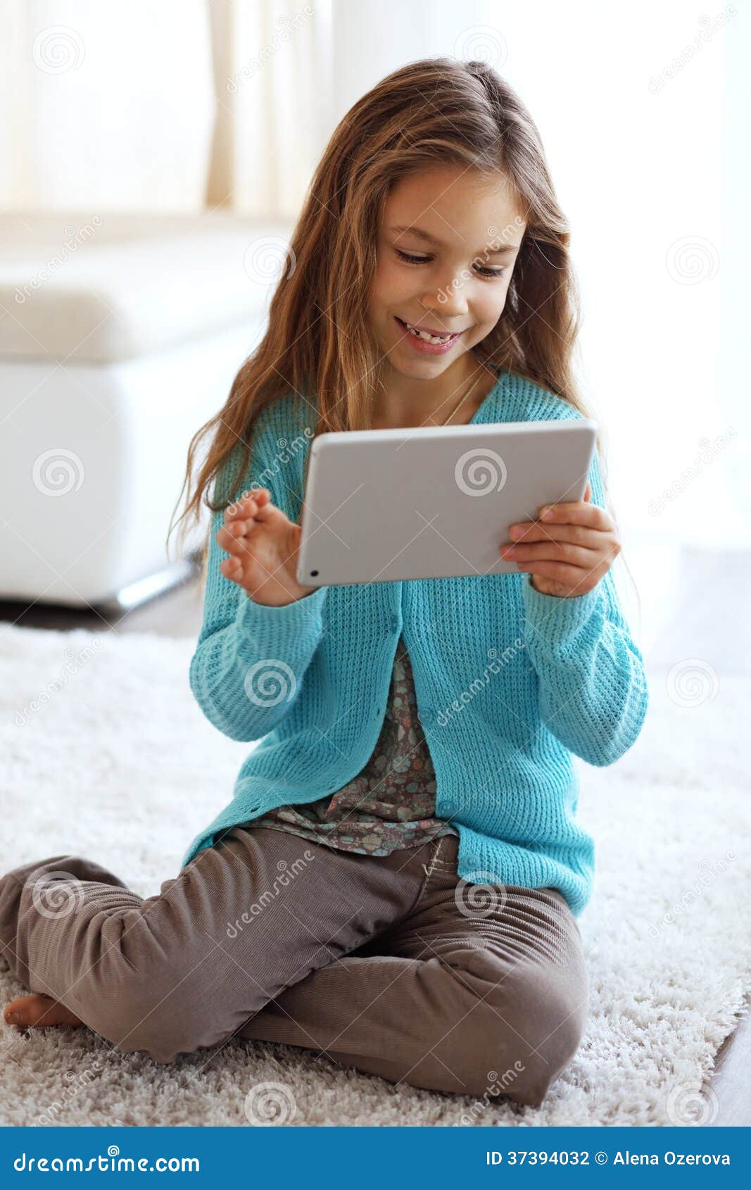 Child playing on tablet pc stock photo. Image of living - 37394032