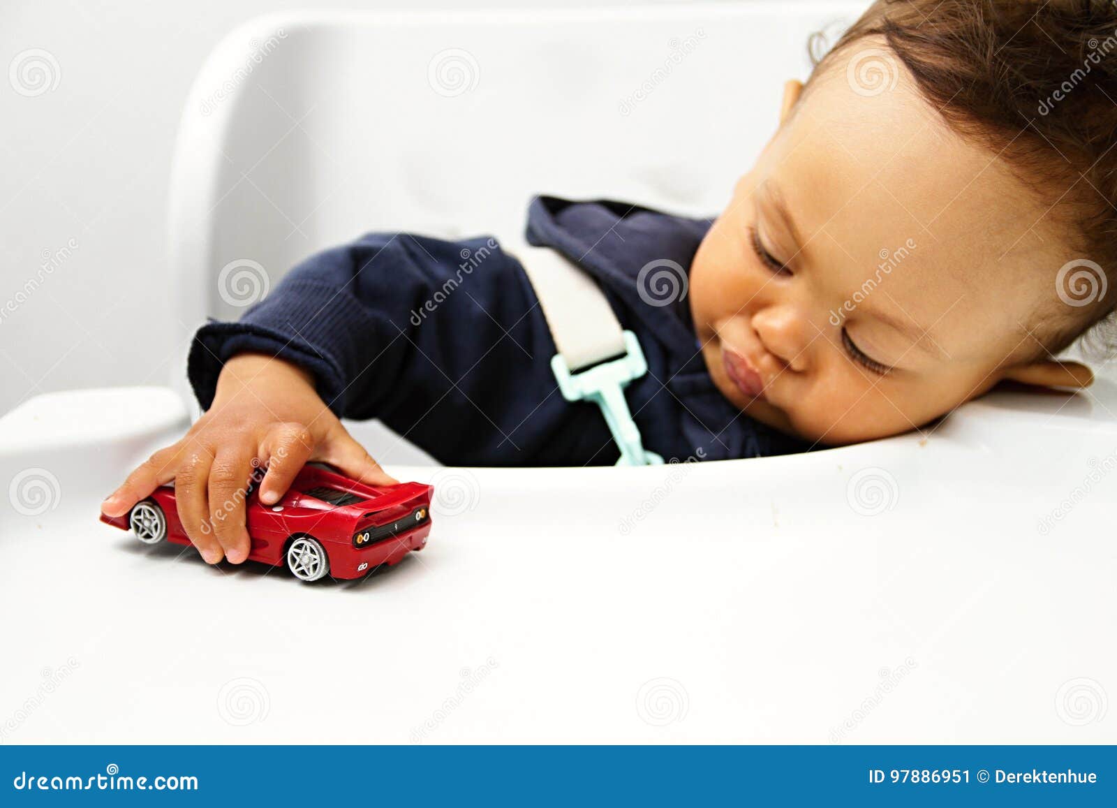Child playing with toy car stock image. Image of child - 97886951