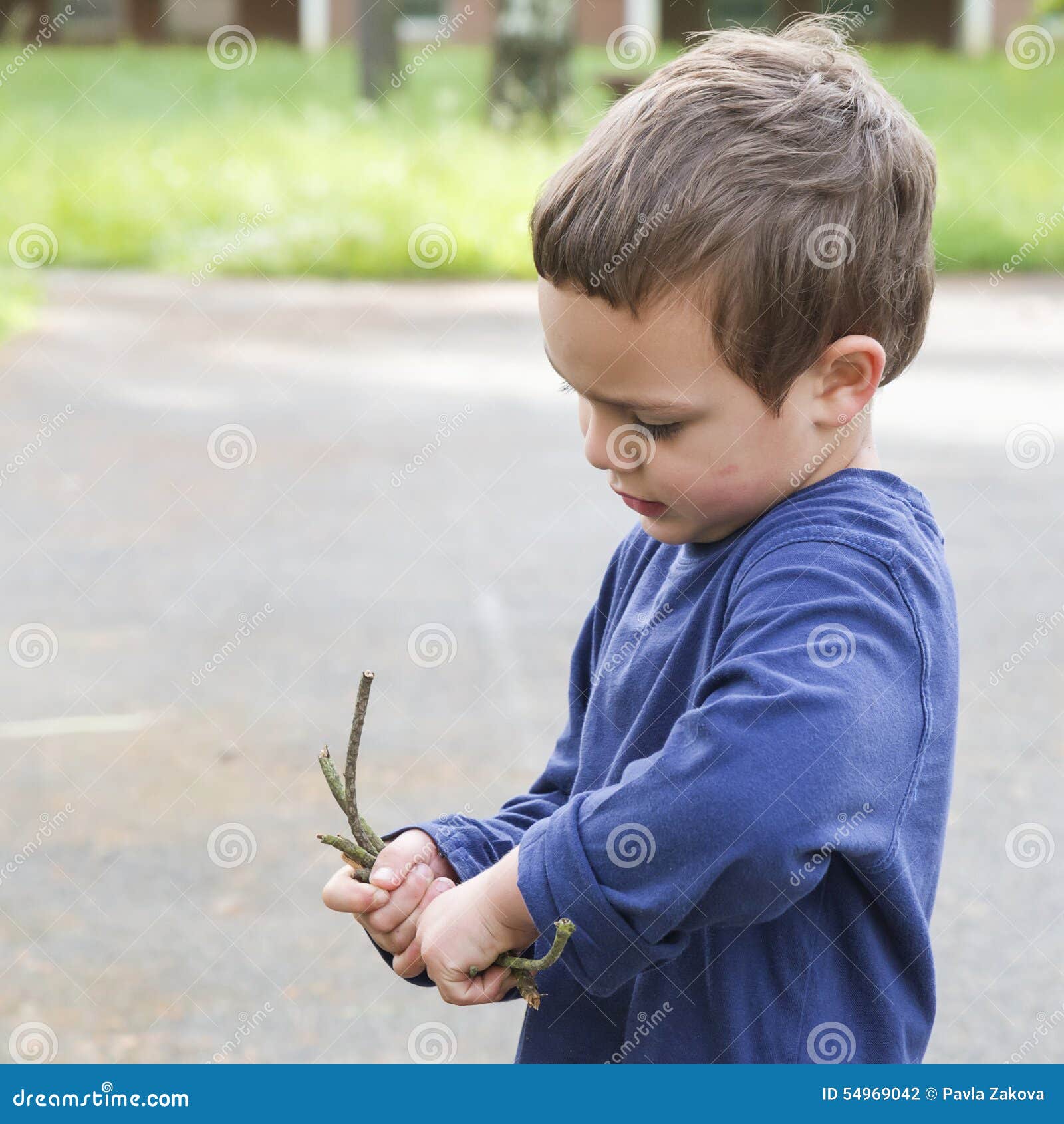 Child playing with twigs stock photo. Image of tree, twigs - 54969042