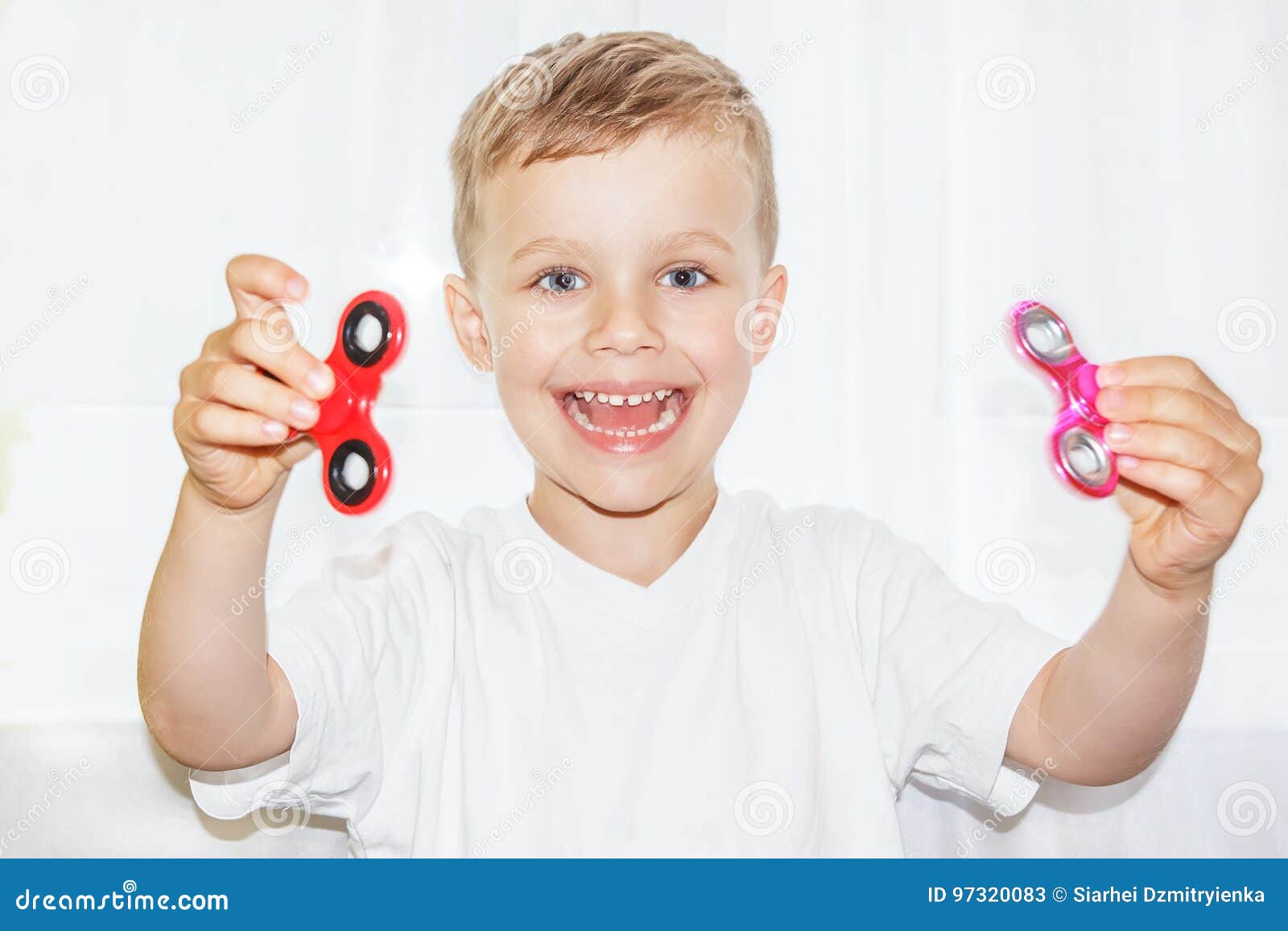 Child Playing with Two Fidget Spinners. Stock Image - Image of fidget ...