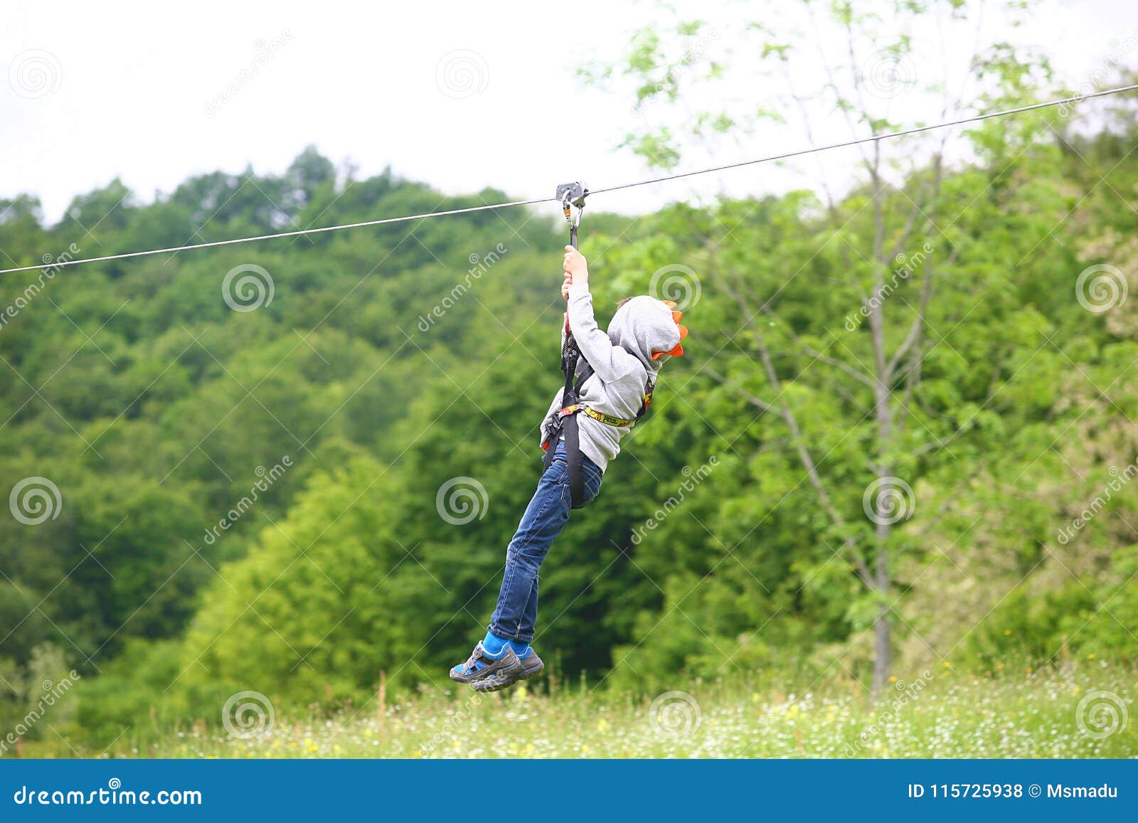 A Child is Playing with a Tyrolean Traverse. Stock Photo - Image of ...