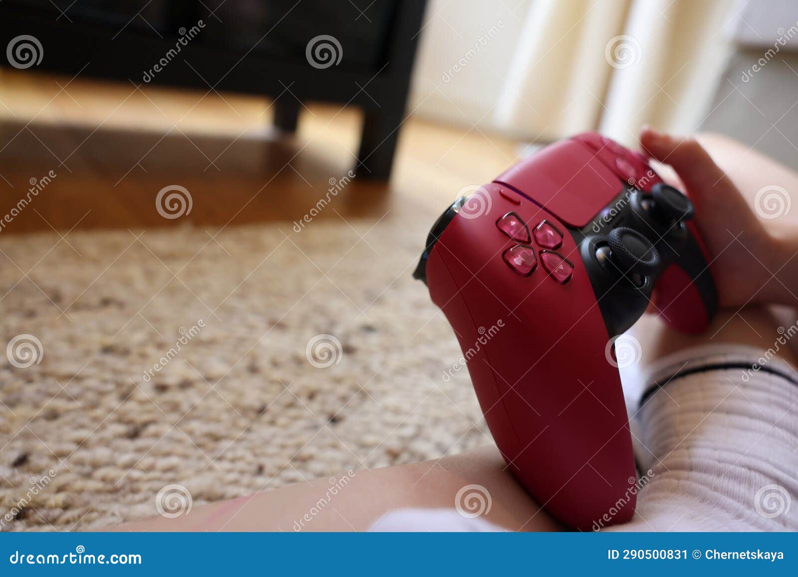 Child Playing Video Games with Controller at Home, Closeup. Space for ...
