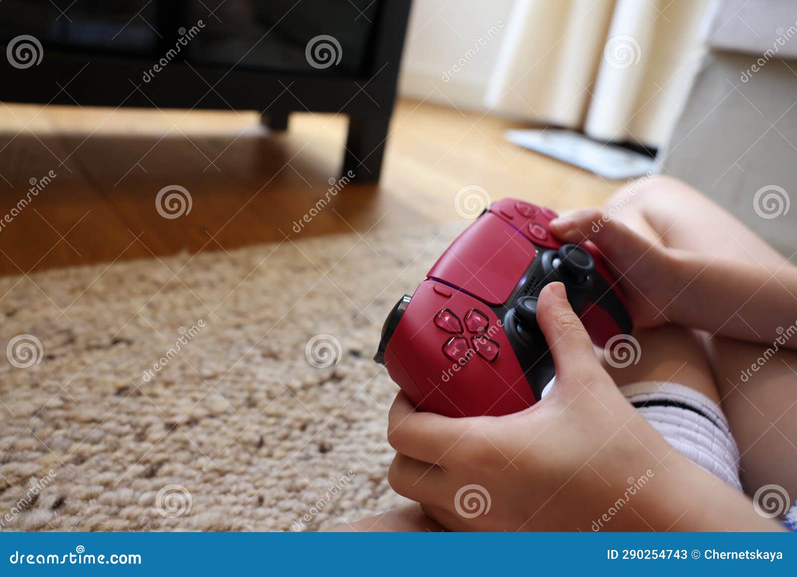 Child Playing Video Games with Controller at Home, Closeup. Space for ...