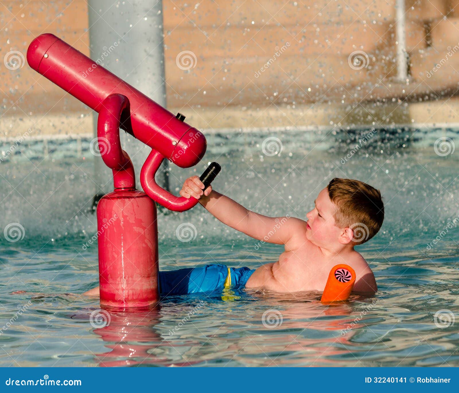 Child Playing with Water Cannon at Kiddie Pool Stock Image - Image of ...